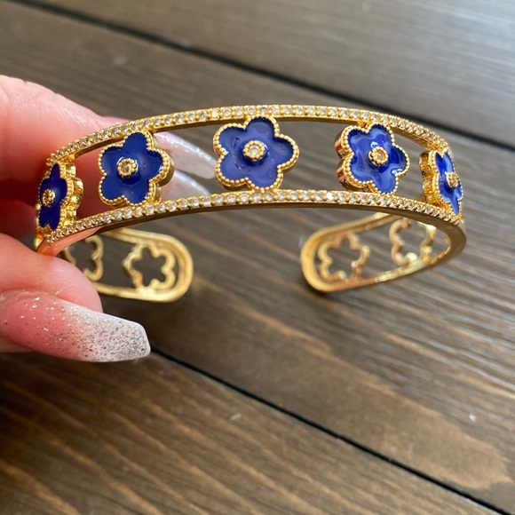 Jewelry | Gold Stainless Steel C Syle Bangle Accented With Blue Flowers ...